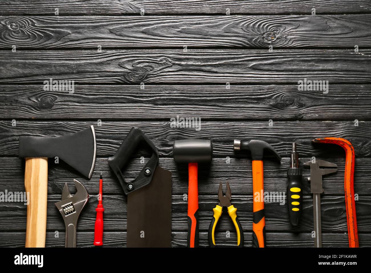 Set of construction tools on dark wooden background Stock Photo - Alamy
