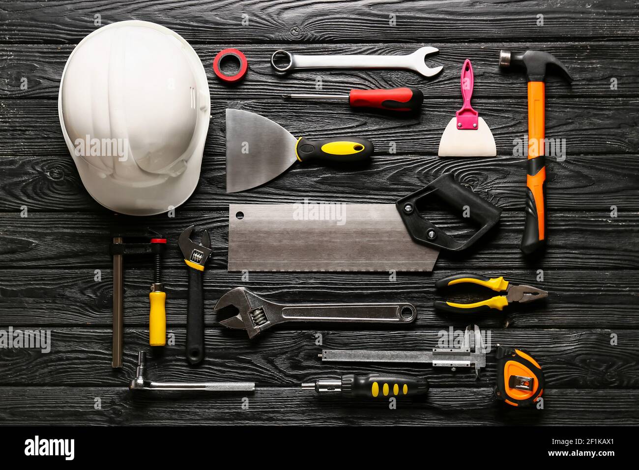 Set of construction tools on dark wooden background Stock Photo - Alamy