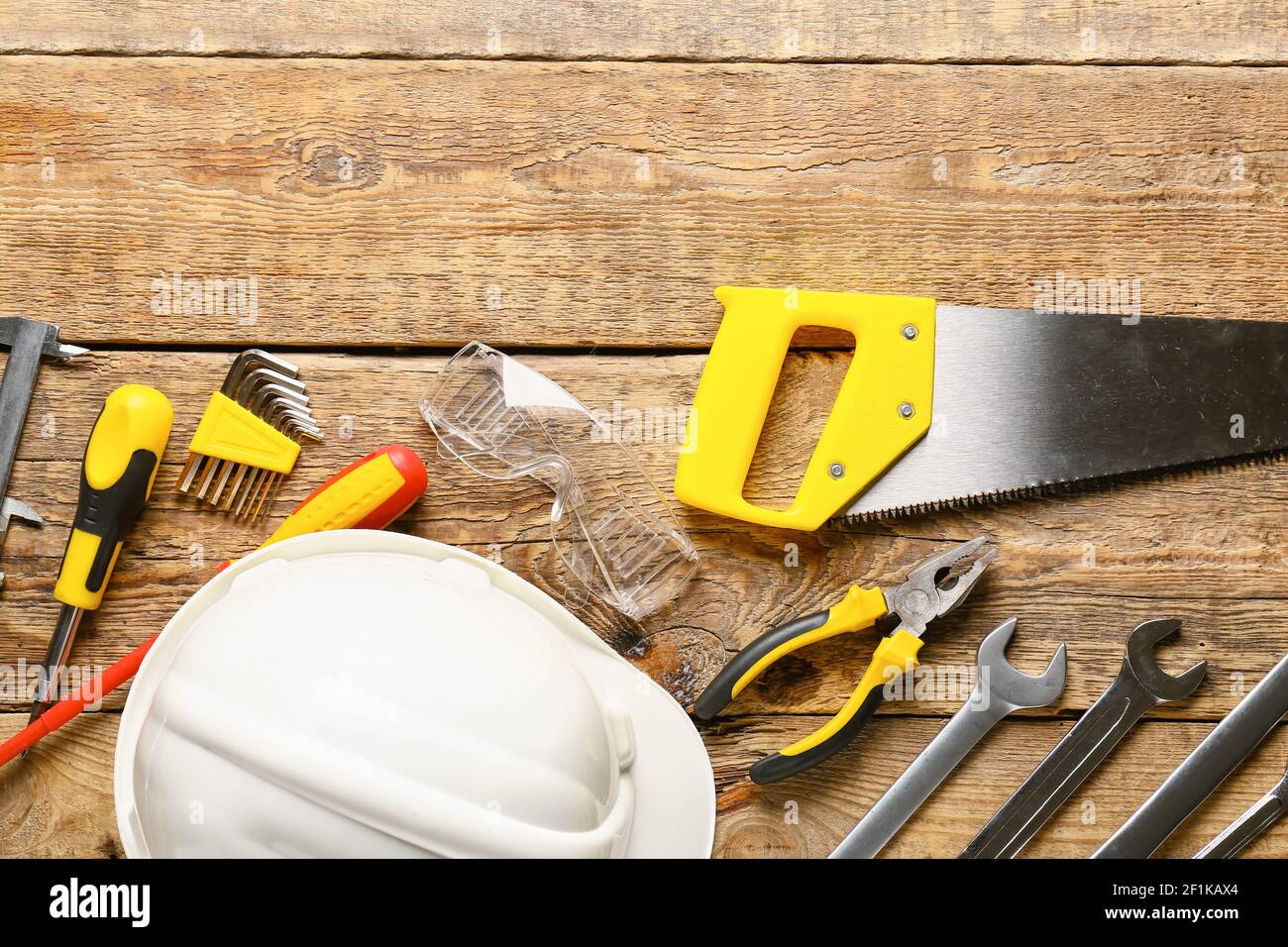 Set of construction tools on wooden background Stock Photo - Alamy