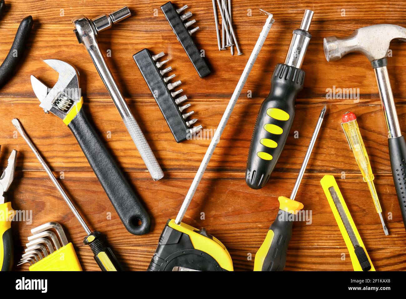 Set of construction tools on wooden background Stock Photo - Alamy