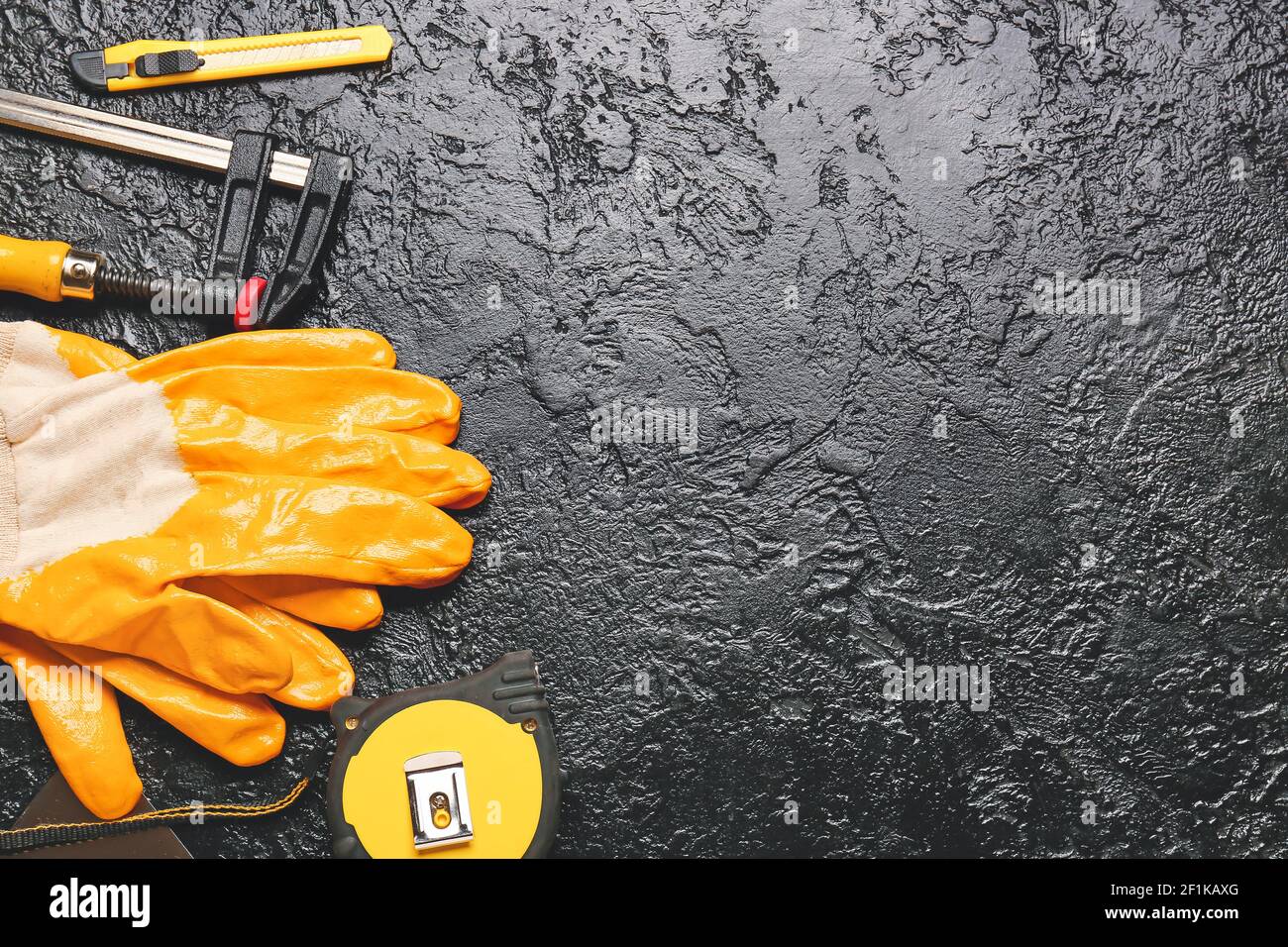 Set of construction tools on dark background Stock Photo - Alamy