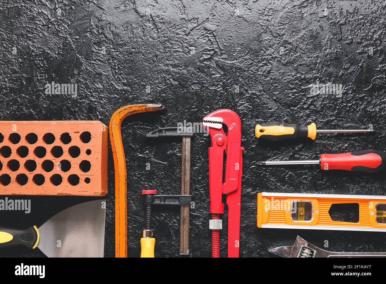 Set of construction tools on dark background Stock Photo - Alamy