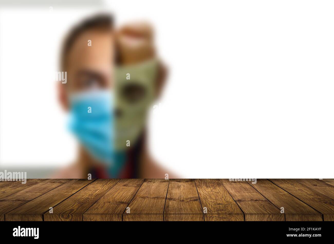 Empty wooden deck table with masked man Stock Photo - Alamy