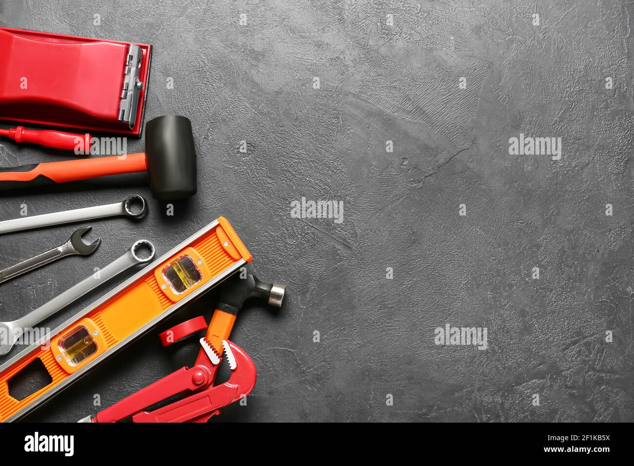 Set of construction tools on dark background Stock Photo - Alamy