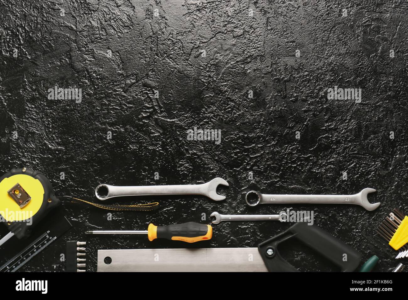 Set of construction tools on dark background Stock Photo - Alamy