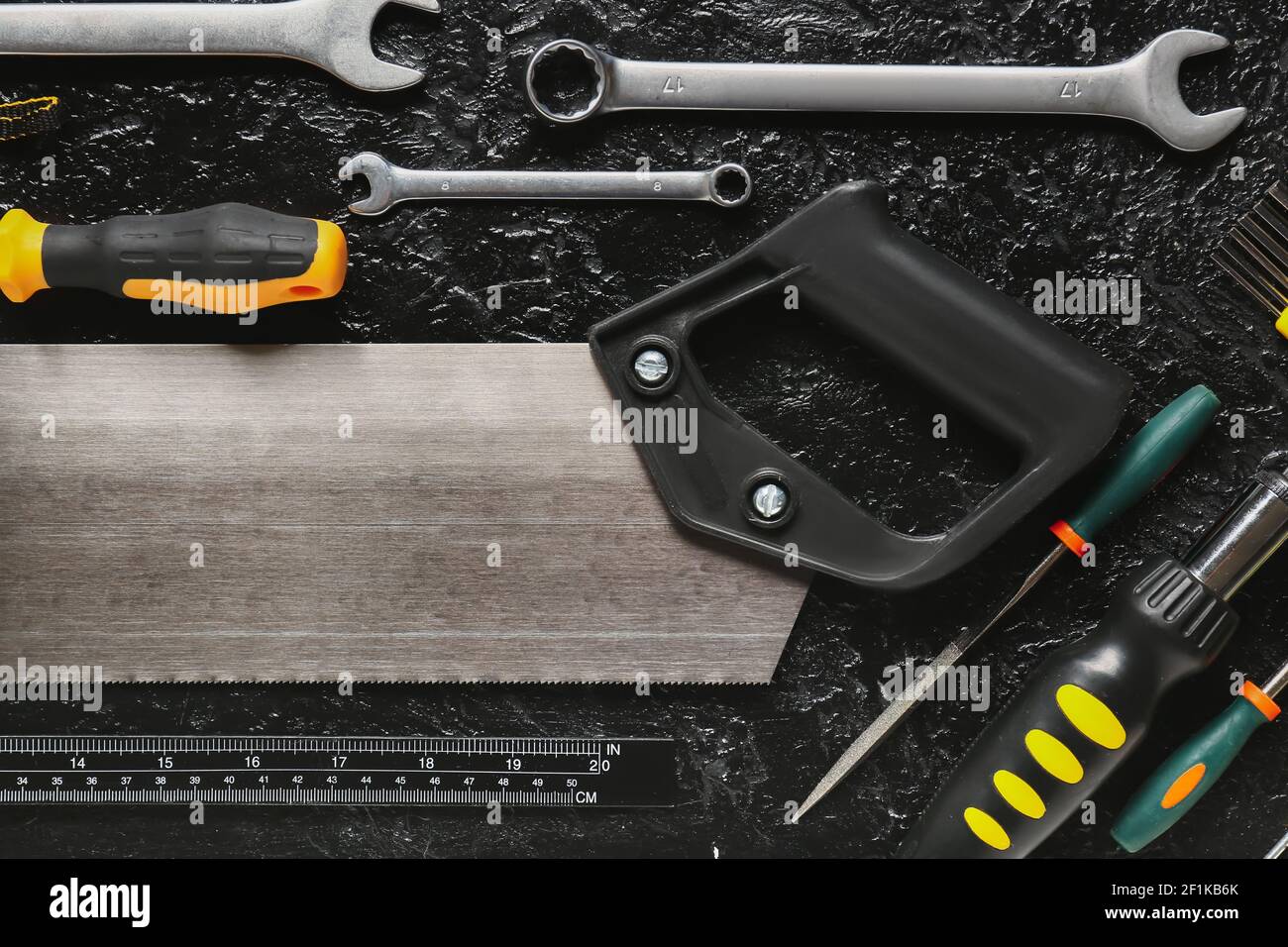 Set of construction tools on dark background Stock Photo - Alamy