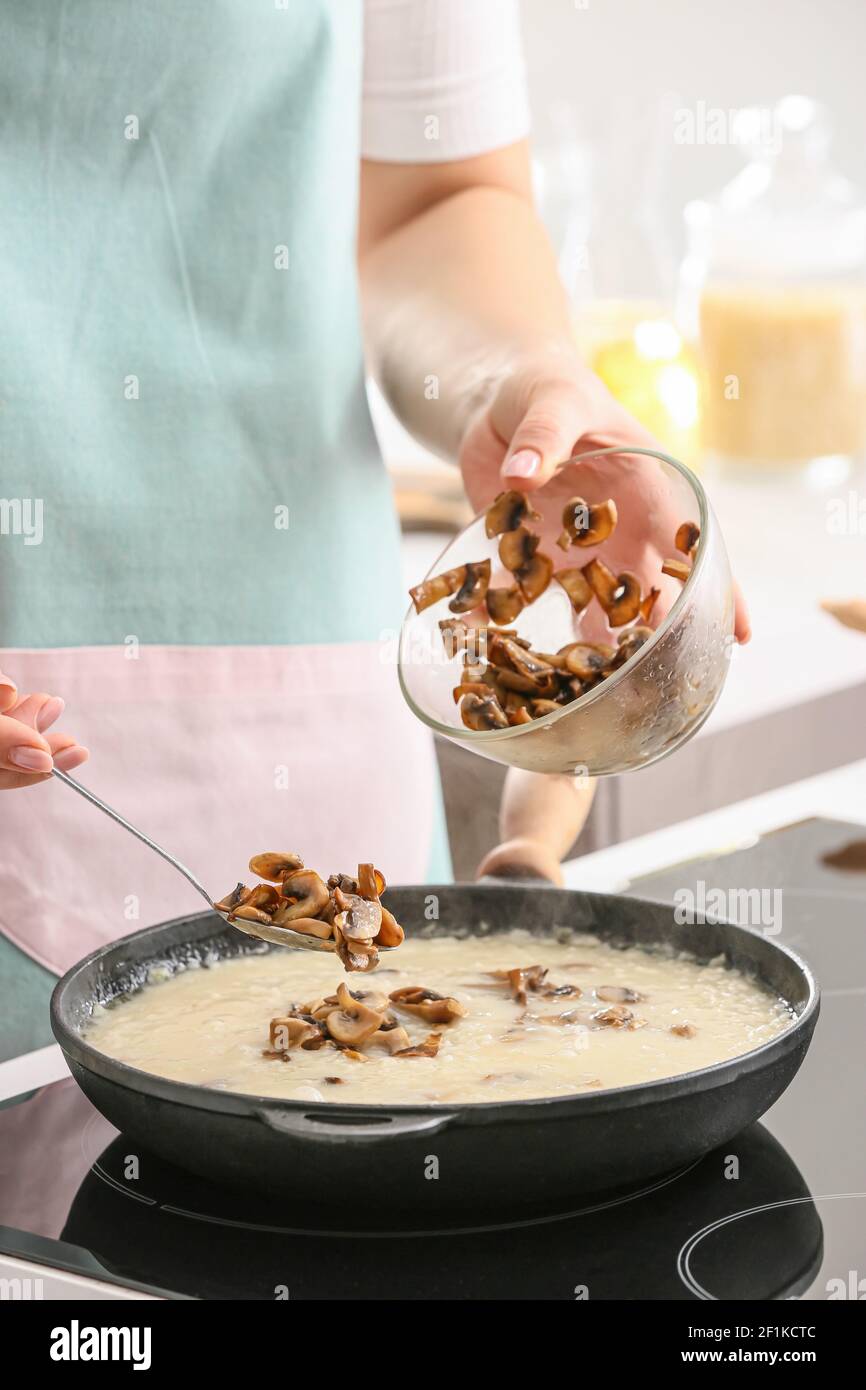 Woman hands cooking adding rice hi-res stock photography and images - Alamy