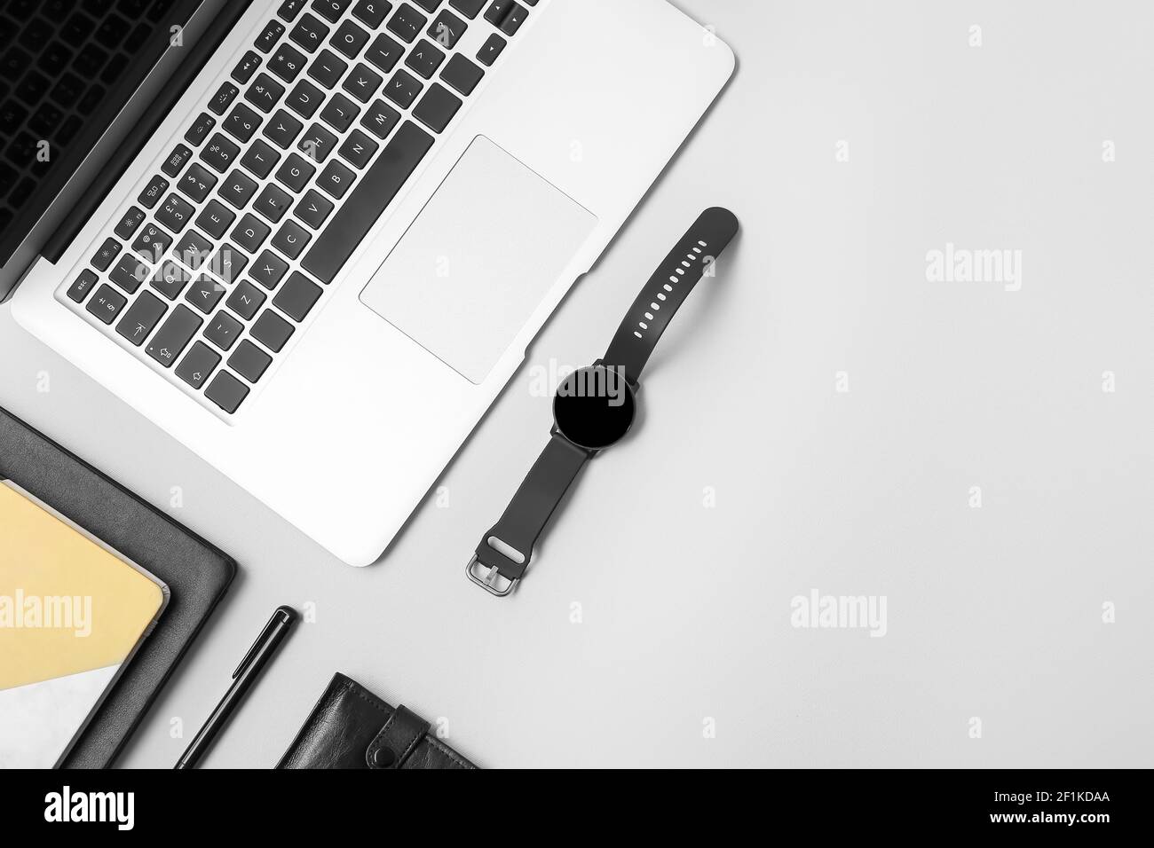 Modern smart watch, laptop and notebooks on light background Stock ...