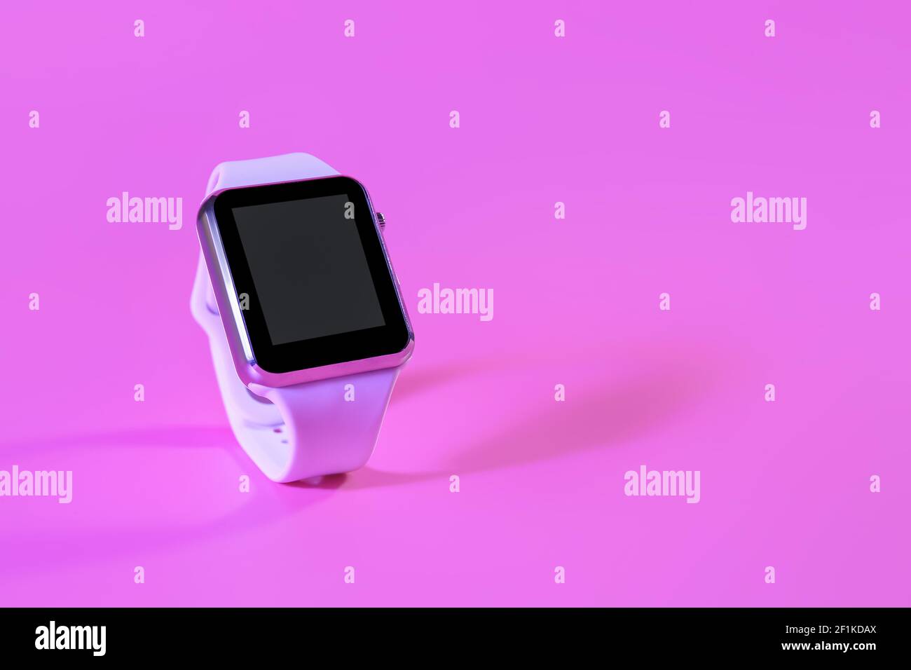 Modern smart watch on color background Stock Photo - Alamy