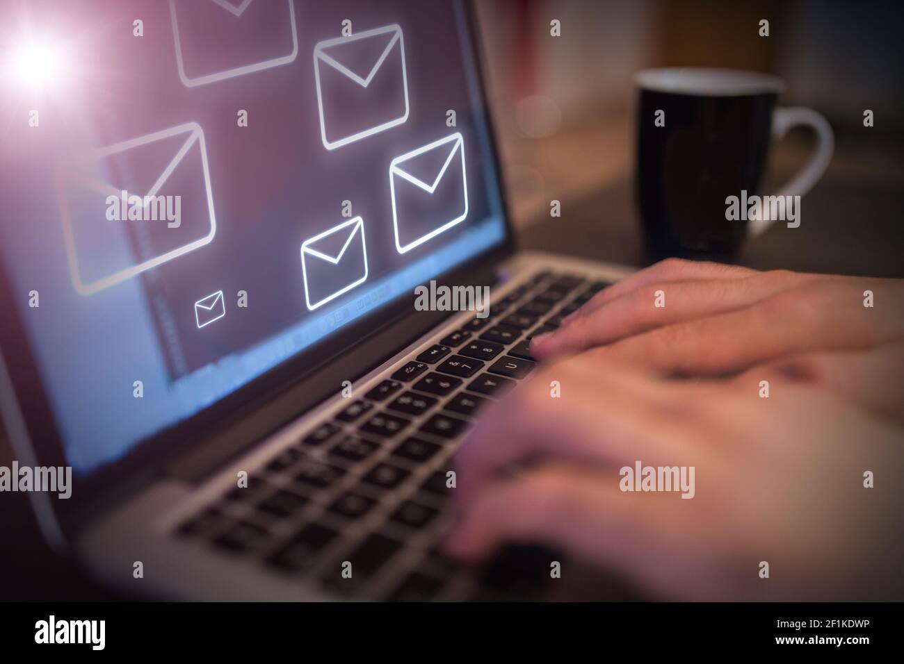 E-mail icons that come from a personal computer screen Stock Photo - Alamy