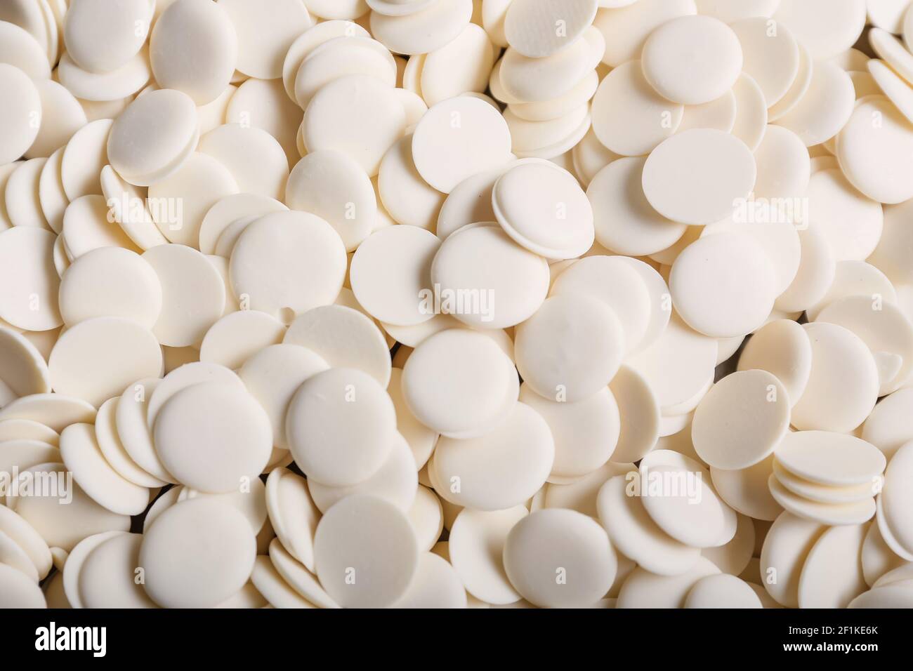 Sweet chocolate drops as background Stock Photo - Alamy