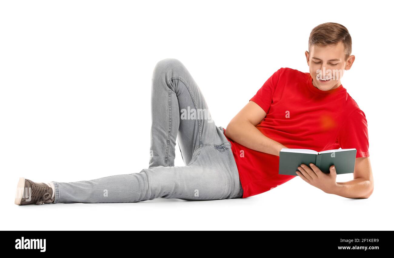 Young man reading book on white background Stock Photo - Alamy