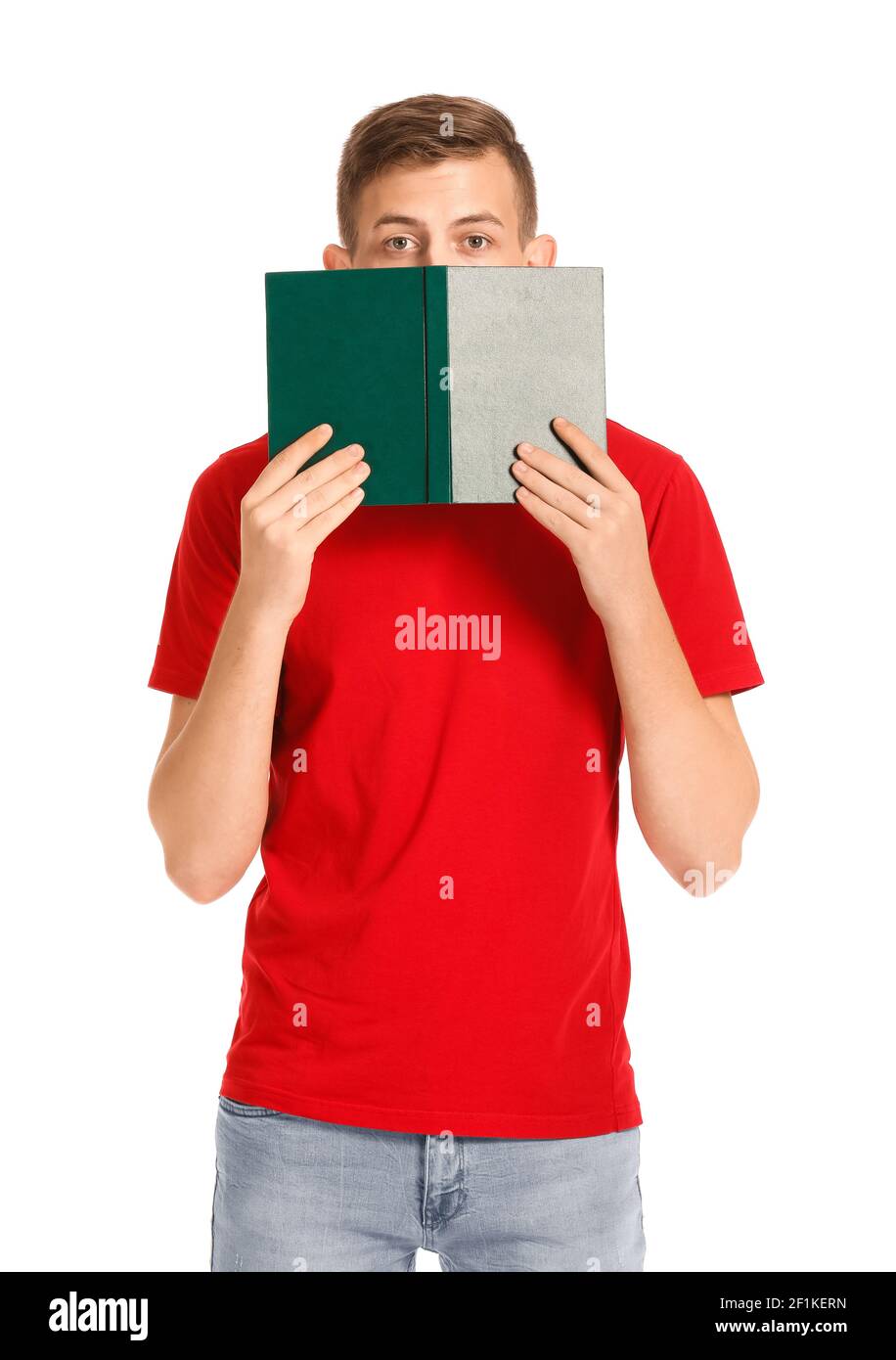Young man with book on white background Stock Photo - Alamy