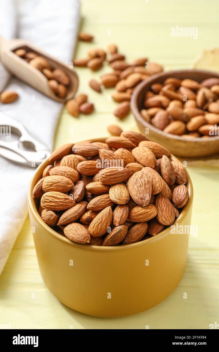 Box with tasty almonds on wooden background Stock Photo - Alamy