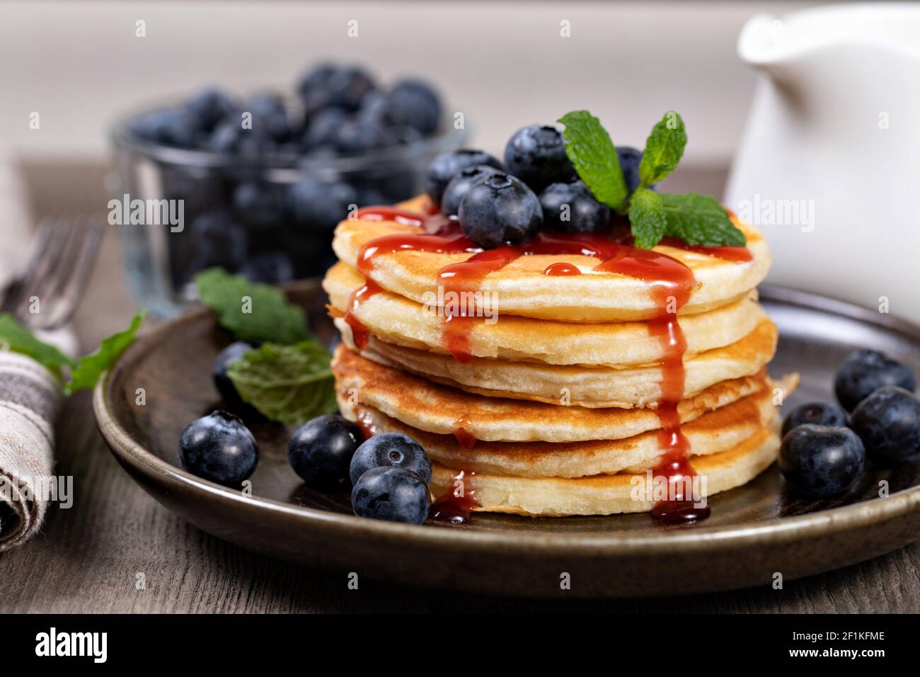 Pancakes with blueberries and syrup Stock Photo - Alamy