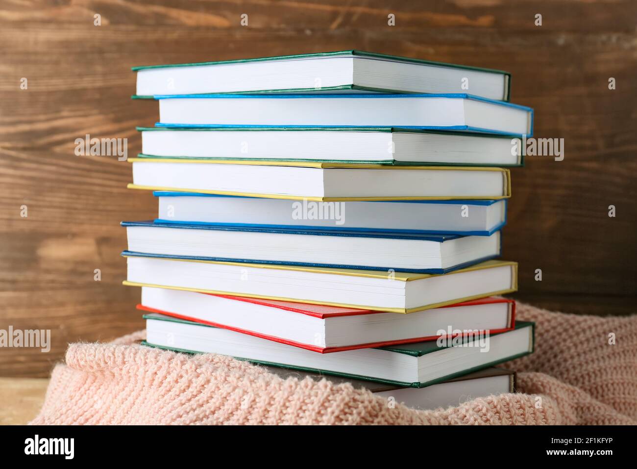 Stack of books on wooden background Stock Photo - Alamy