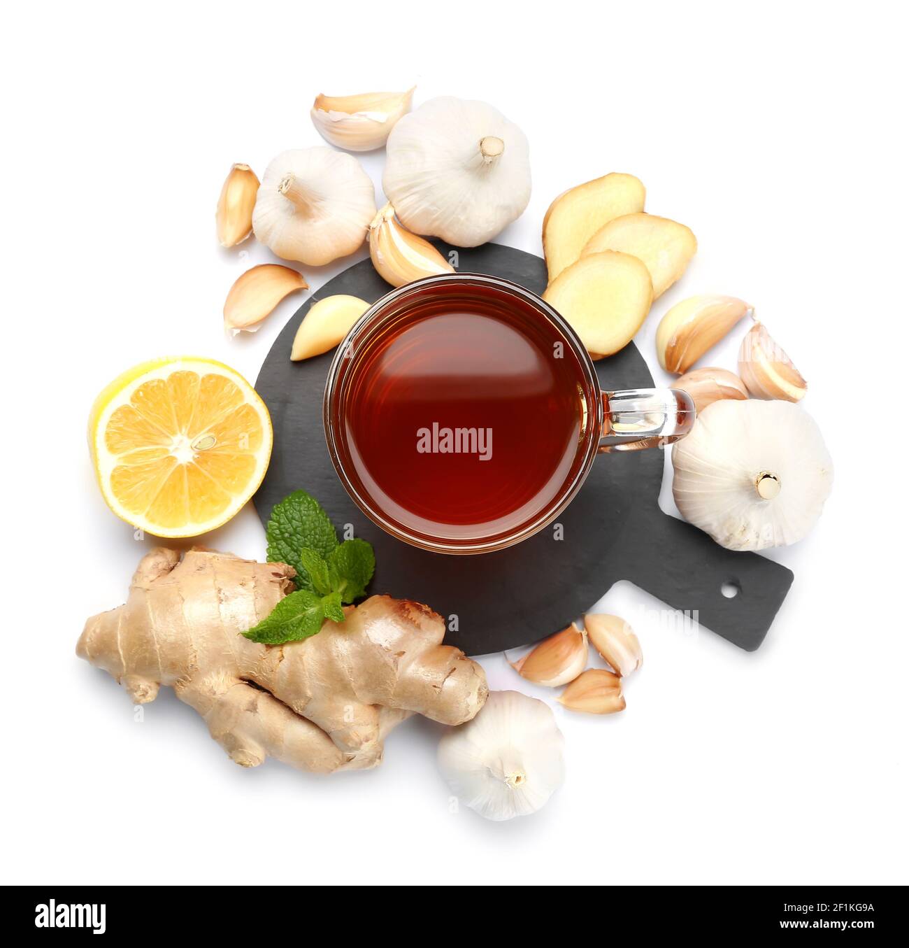 Cup of healthy garlic tea on white background Stock Photo - Alamy