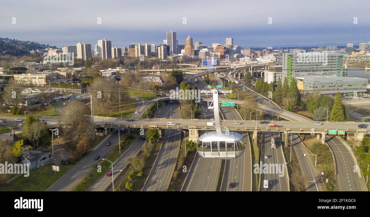 Over the Highway Portland Oregon People Mover Tram Stock Photo - Alamy