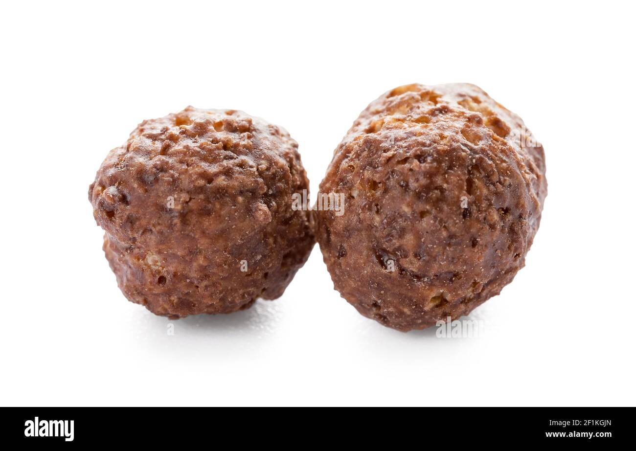 Tasty chocolate corn balls on white background Stock Photo - Alamy