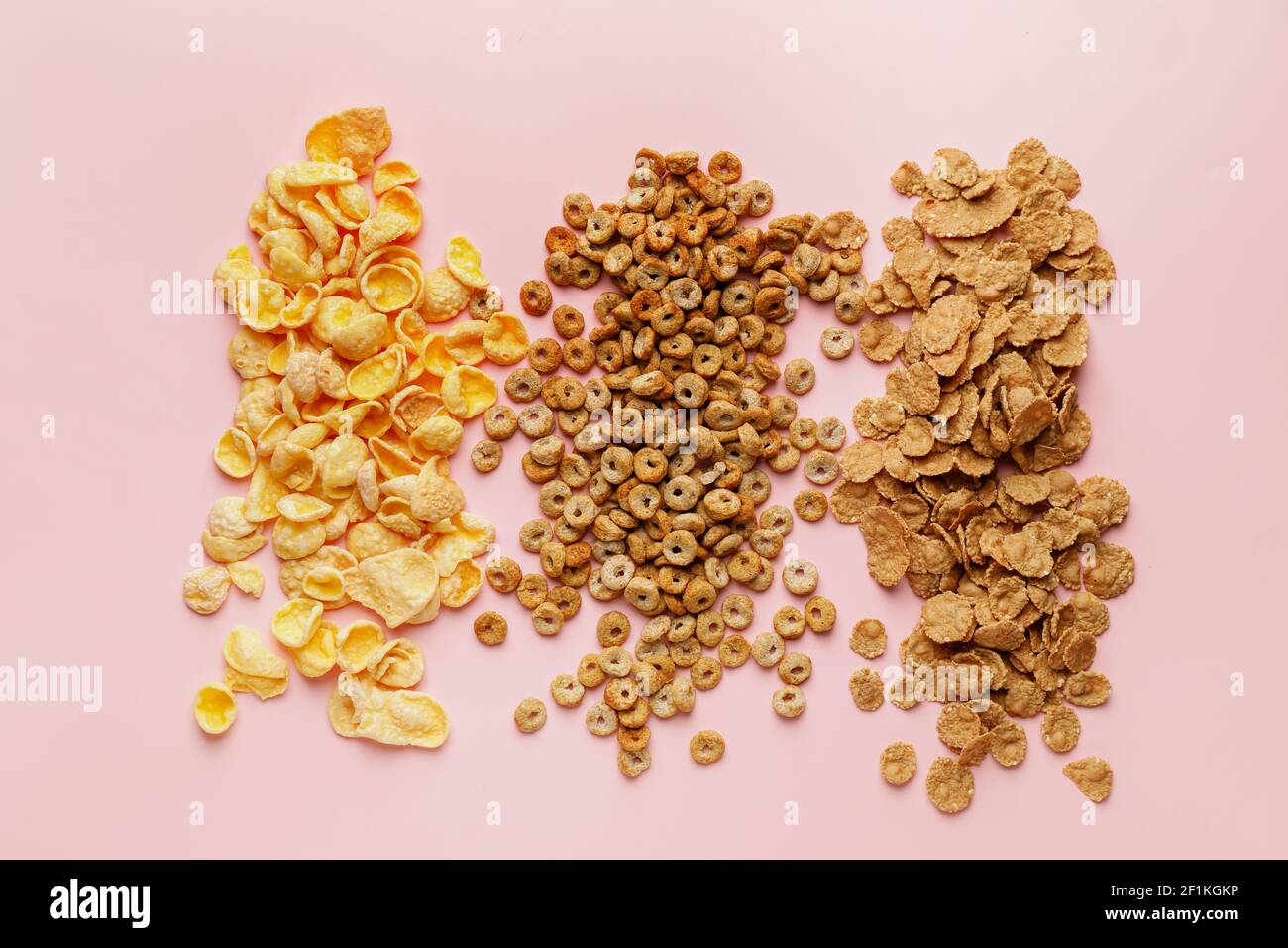 Different tasty cereals on color background Stock Photo - Alamy