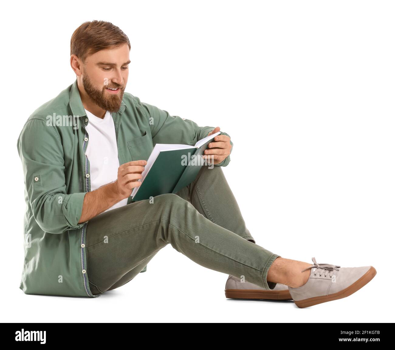 Young man reading book on white background Stock Photo - Alamy