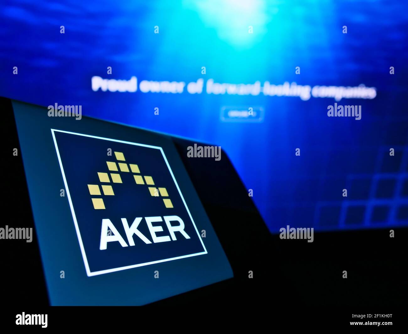 Smartphone with business logo of Norwegian holding company Aker ASA on ...
