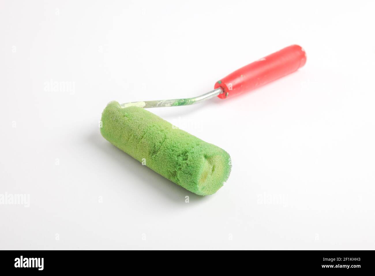 Paint roller in front of a white background Stock Photo - Alamy