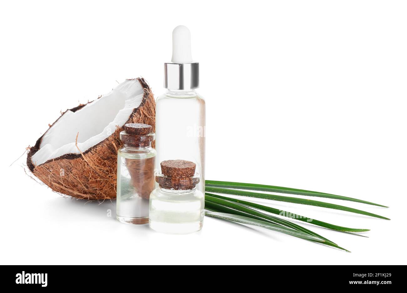 Bottles of coconut oil on white background Stock Photo - Alamy