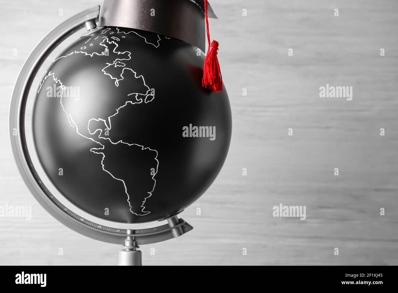 Globe with graduation hat on light background Stock Photo - Alamy
