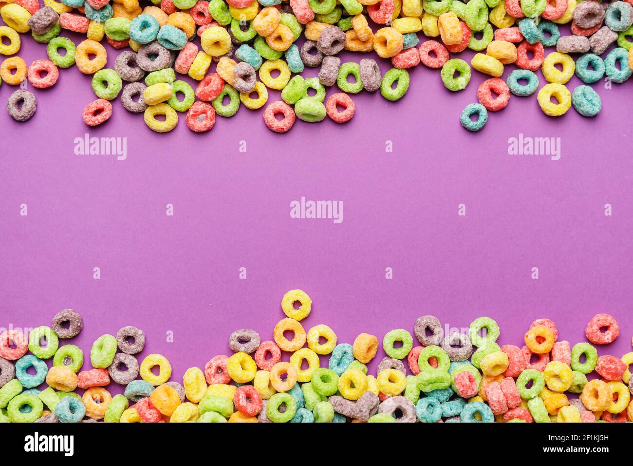 Tasty cereal rings on color background Stock Photo - Alamy
