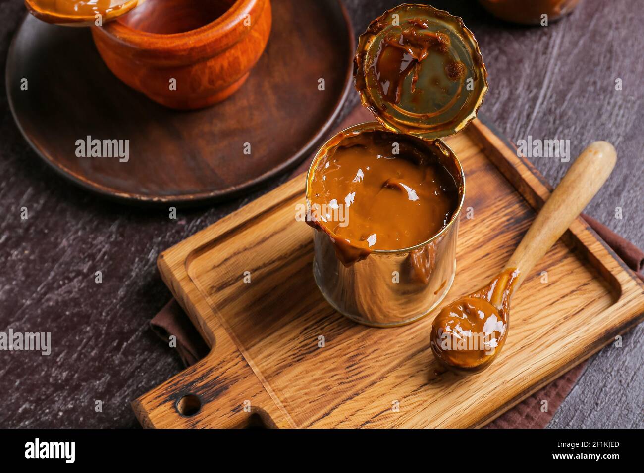 Boiled condensed milk on dark background Stock Photo - Alamy