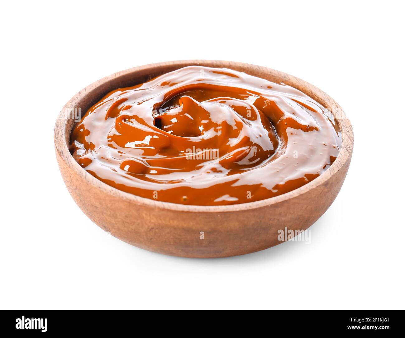 Bowl of boiled condensed milk on white background Stock Photo - Alamy