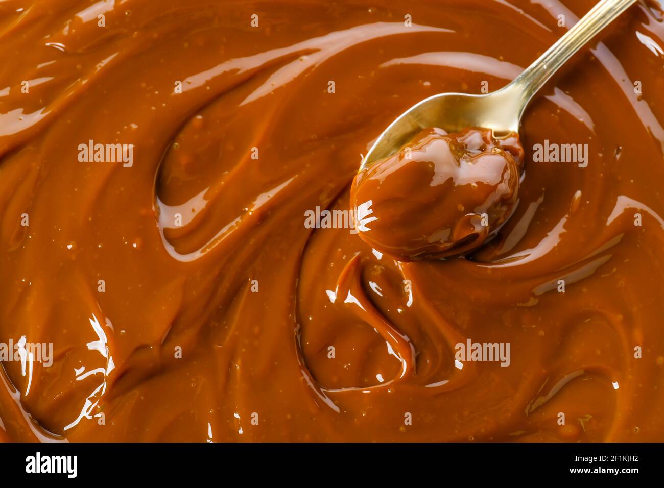 Boiled condensed milk as background Stock Photo - Alamy