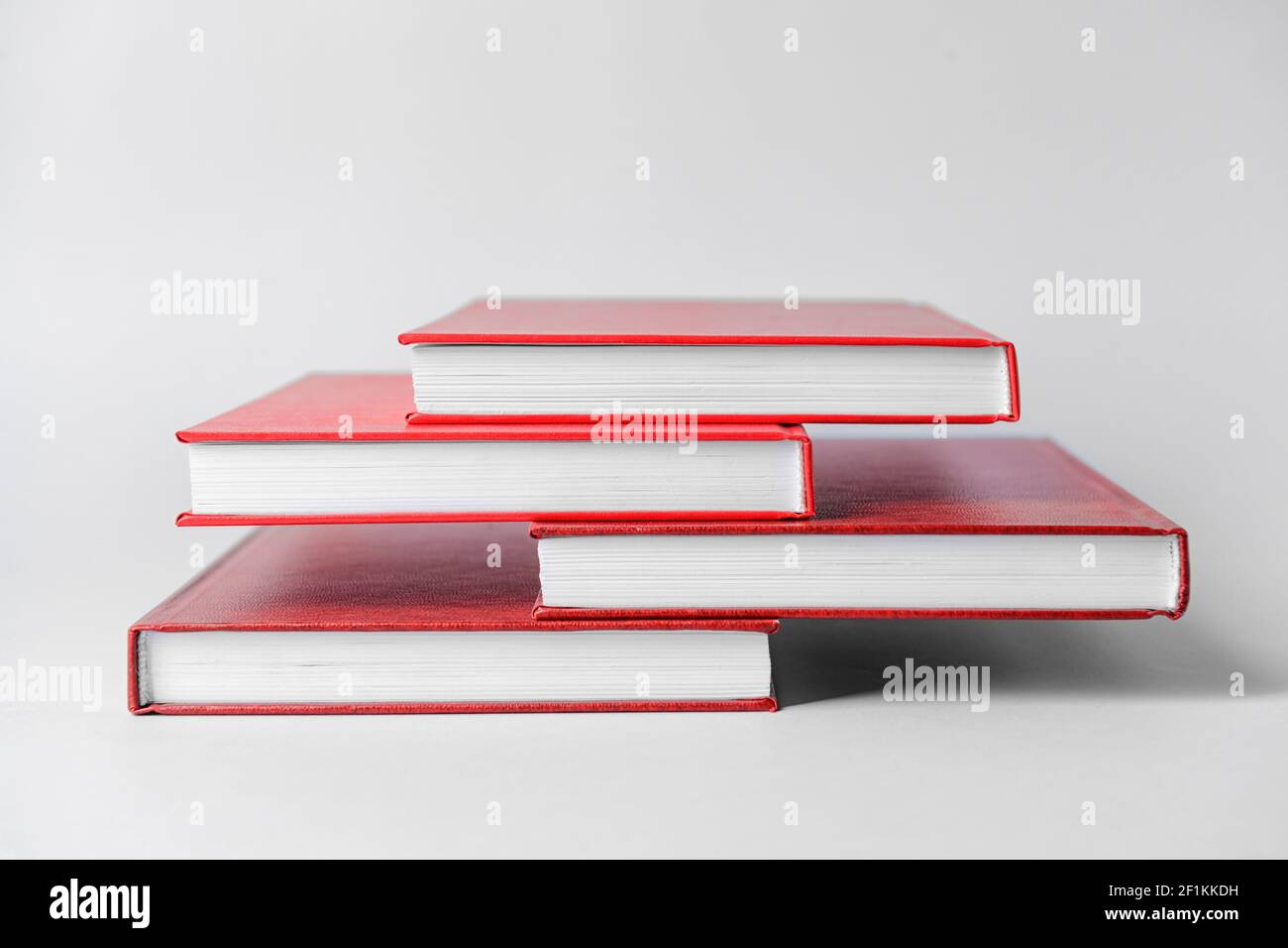 Blank books on light background Stock Photo - Alamy