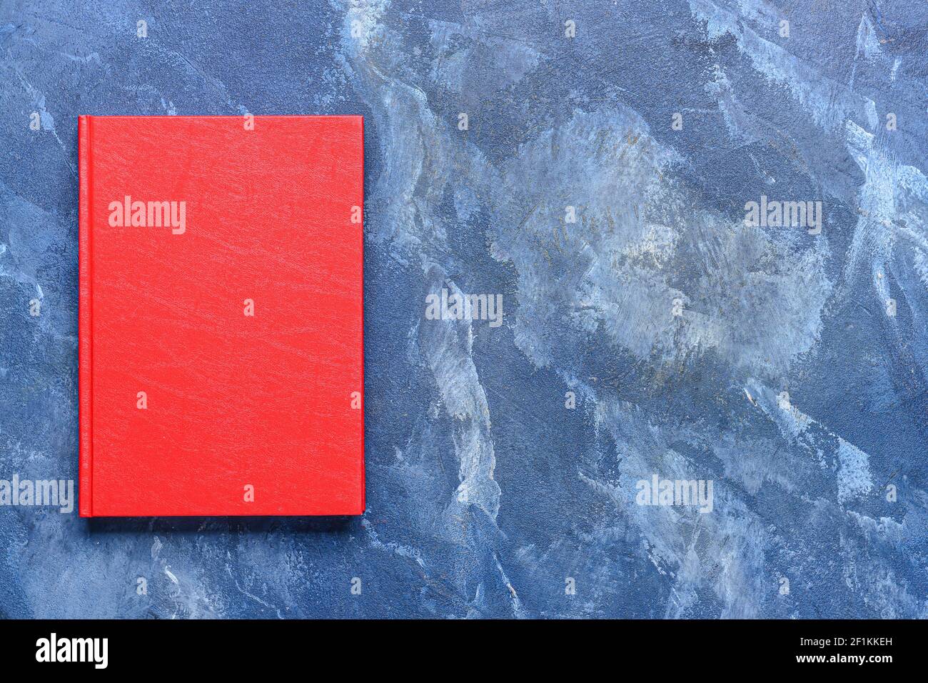 Blank book on color background Stock Photo - Alamy