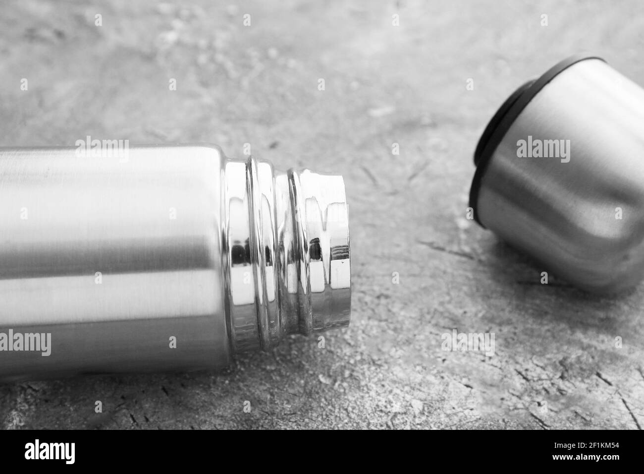 Modern thermos on grunge background, closeup Stock Photo - Alamy