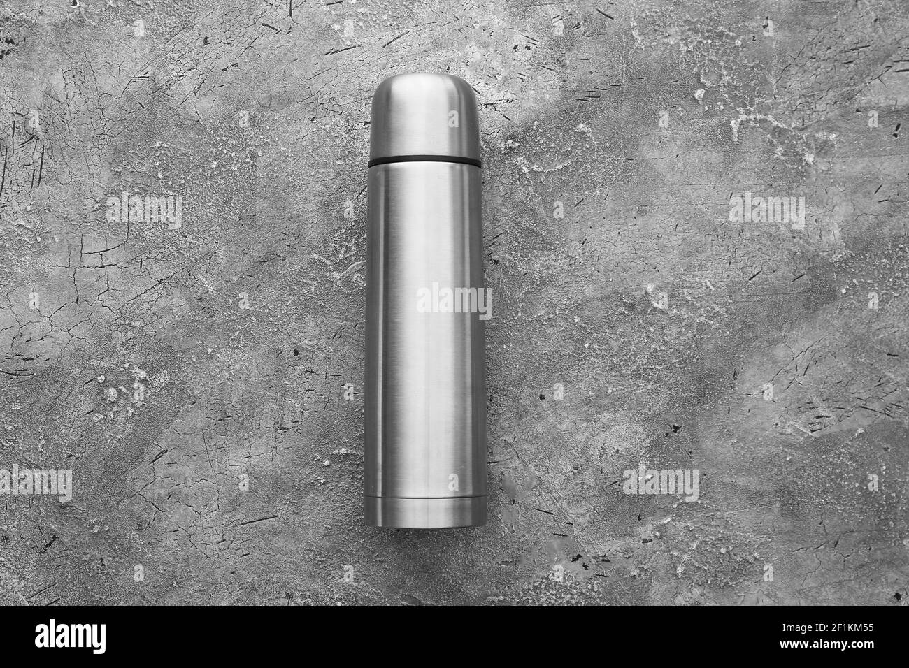 Modern thermos on grunge background Stock Photo - Alamy