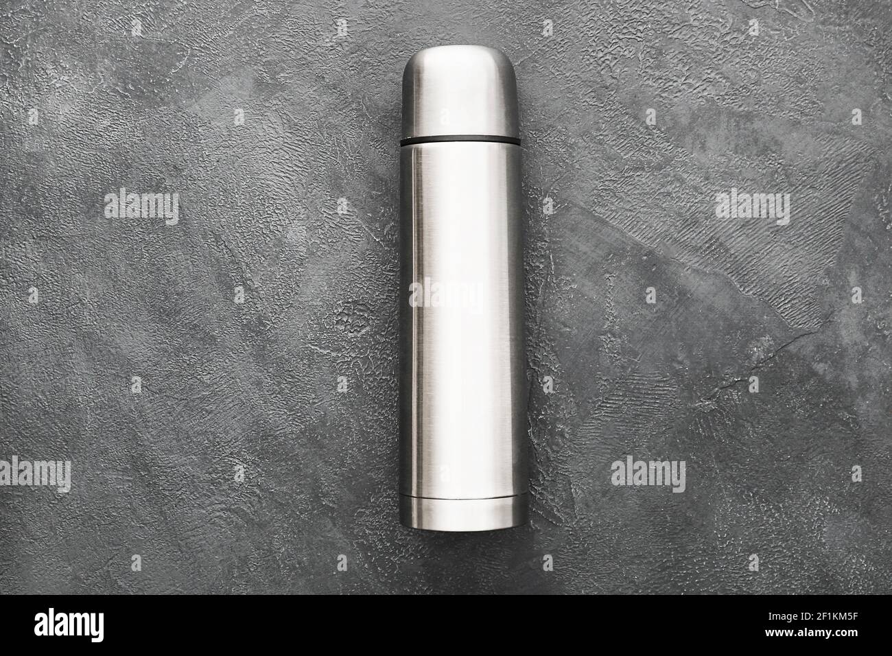 Modern thermos on dark background Stock Photo - Alamy