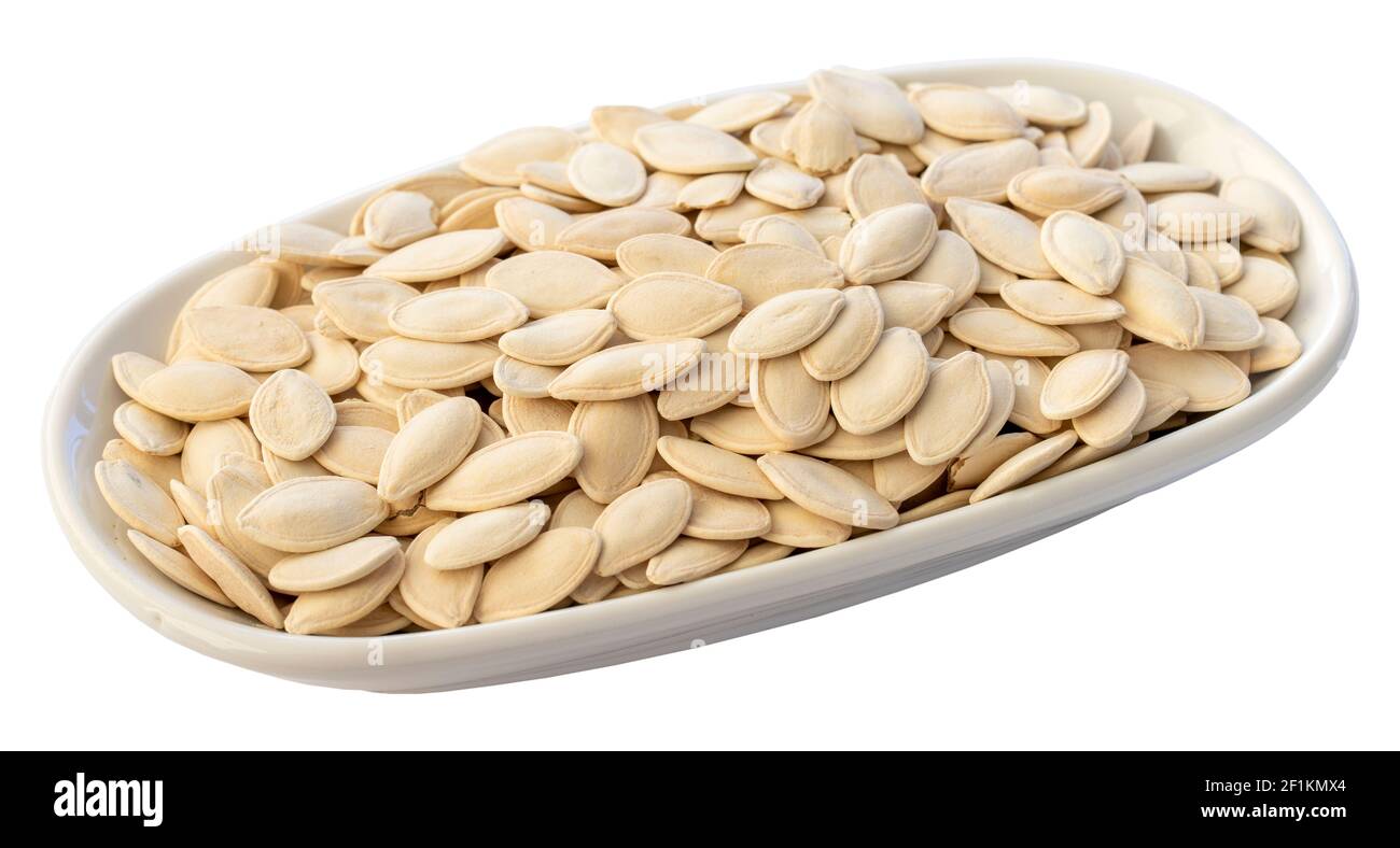 Pumpkin seeds isolated on white background Stock Photo - Alamy