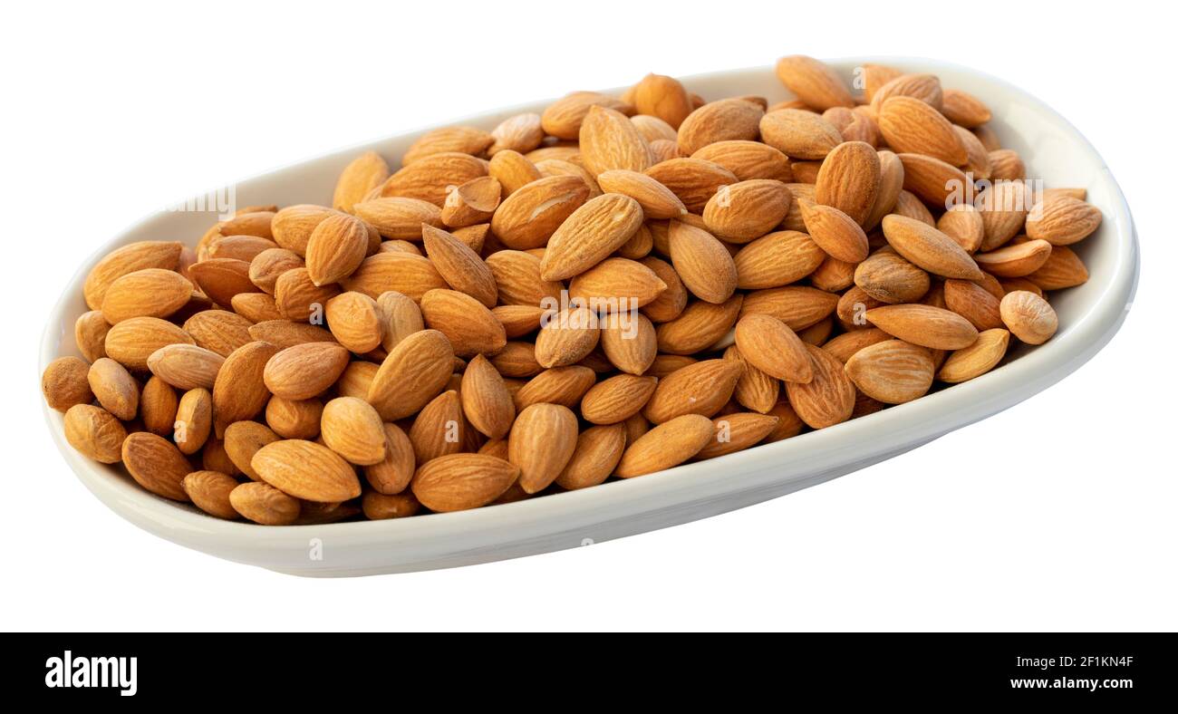 Apricot kernel isolated on white background Stock Photo - Alamy