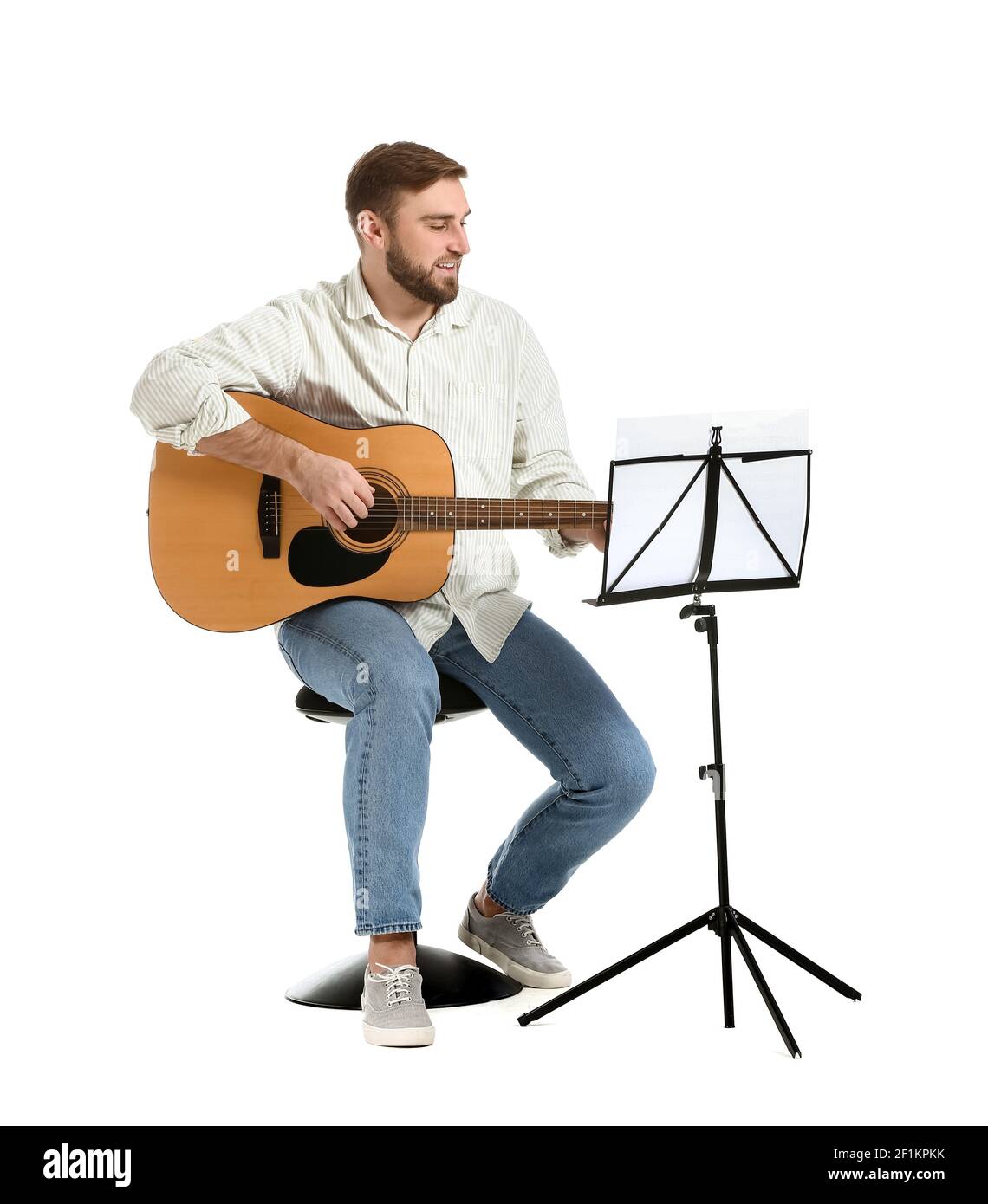 Young man playing guitar on white background Stock Photo - Alamy