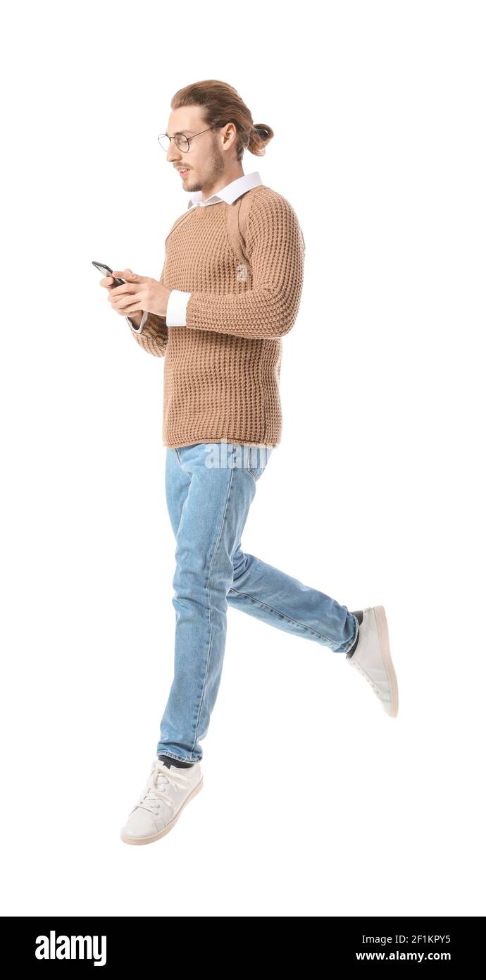 Young man jumping mobile phone Cut Out Stock Images & Pictures - Alamy