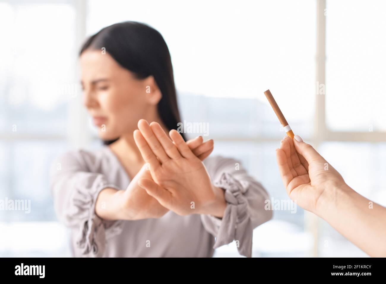 Young woman rejecting cigarette at home. Concept of refusing from bad ...