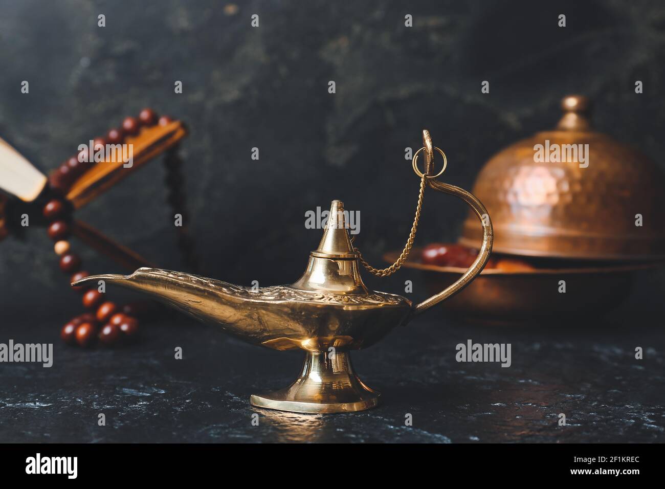 Aladdin lamp of wishes on dark background Stock Photo - Alamy