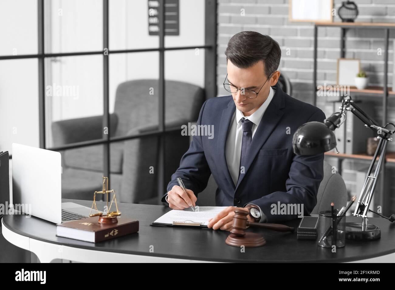 Male judge working in office Stock Photo - Alamy