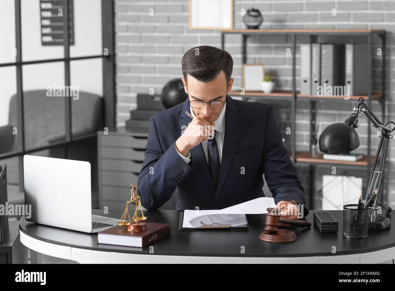 Male judge working in office Stock Photo - Alamy