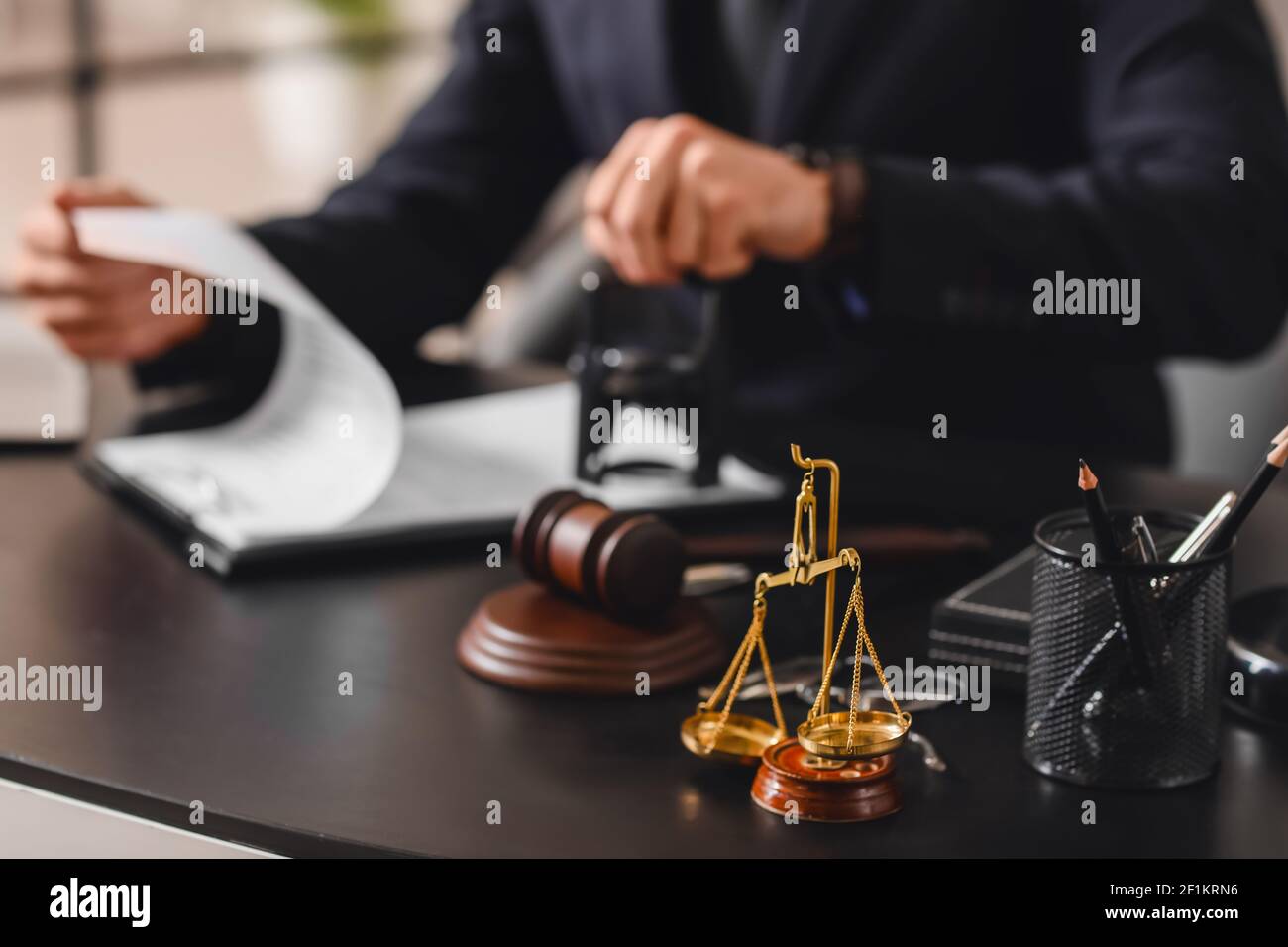 Scales of justice on table of lawyer in office Stock Photo - Alamy