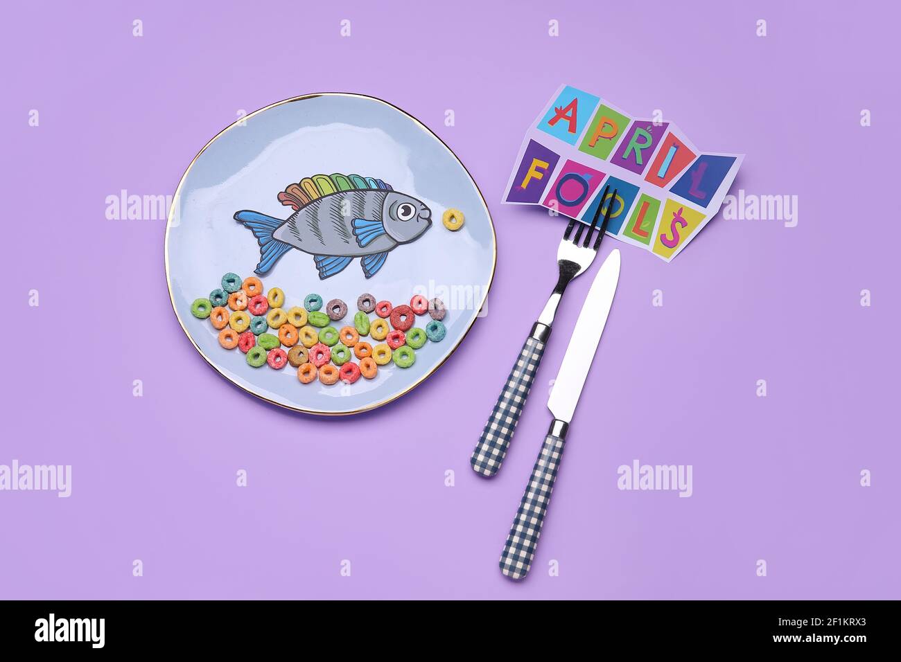 Plate with paper fish on color background. April Fools Day celebration ...