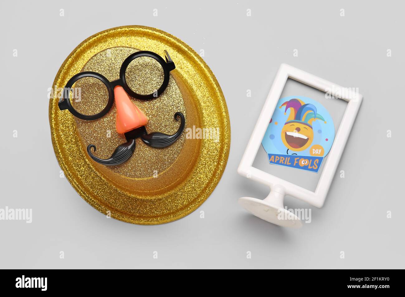Party decor for April Fools Day on grey background Stock Photo - Alamy