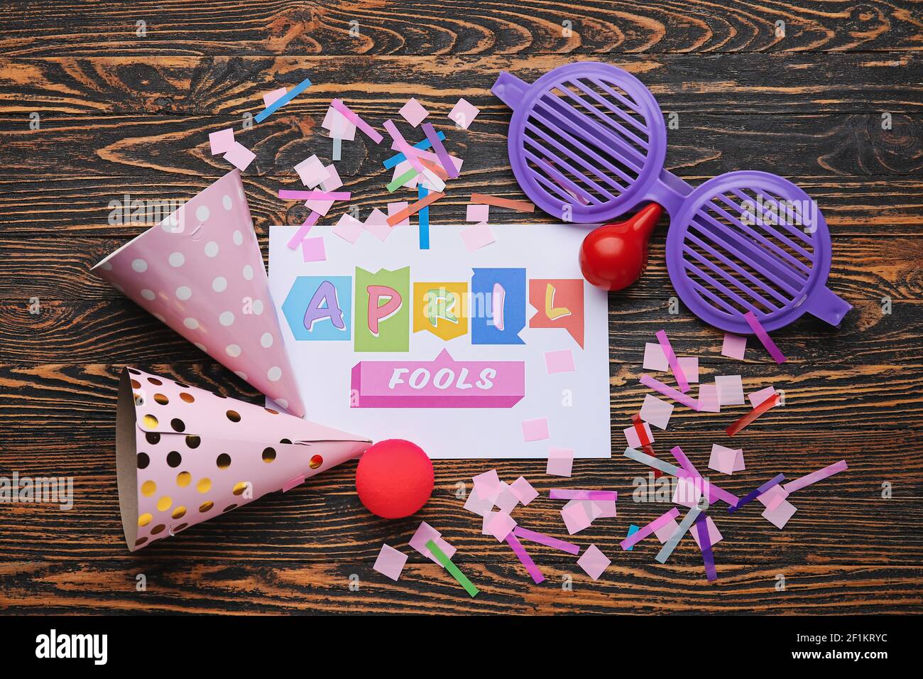 Party decor for April Fools Day on wooden background Stock Photo - Alamy